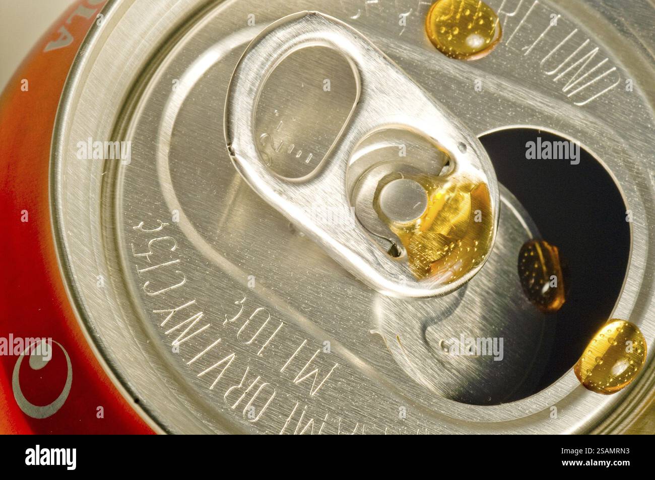 A Cola Drip on the top of a soft drink can Stock Photo - Alamy