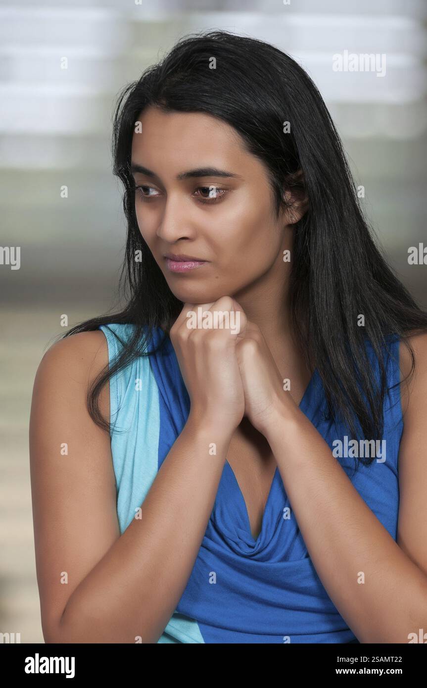 Beautiful woman thinking and deep in thought Stock Photo - Alamy