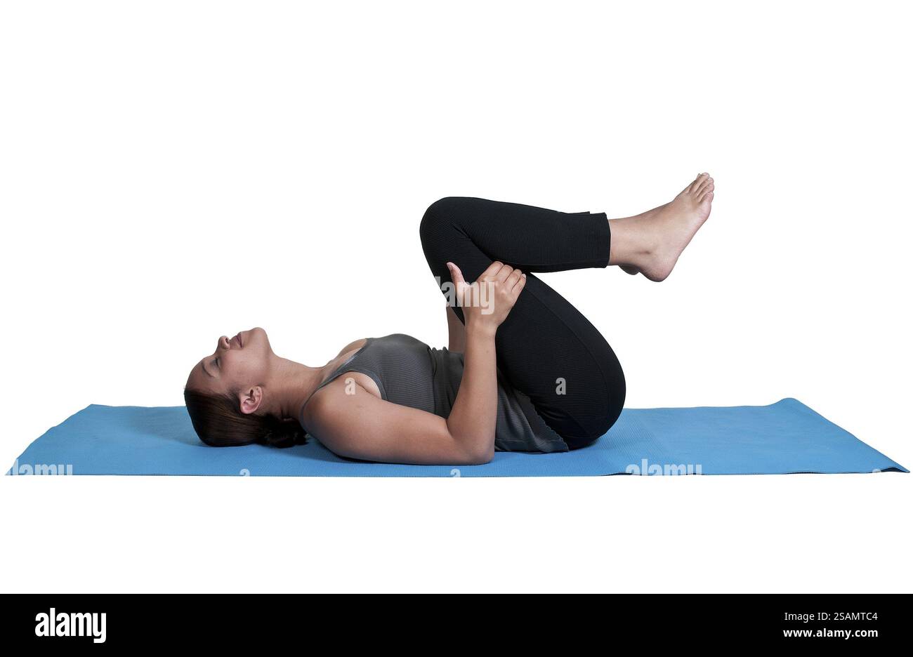 Woman practicing yoga exercise on Cut Out Stock Images & Pictures - Alamy