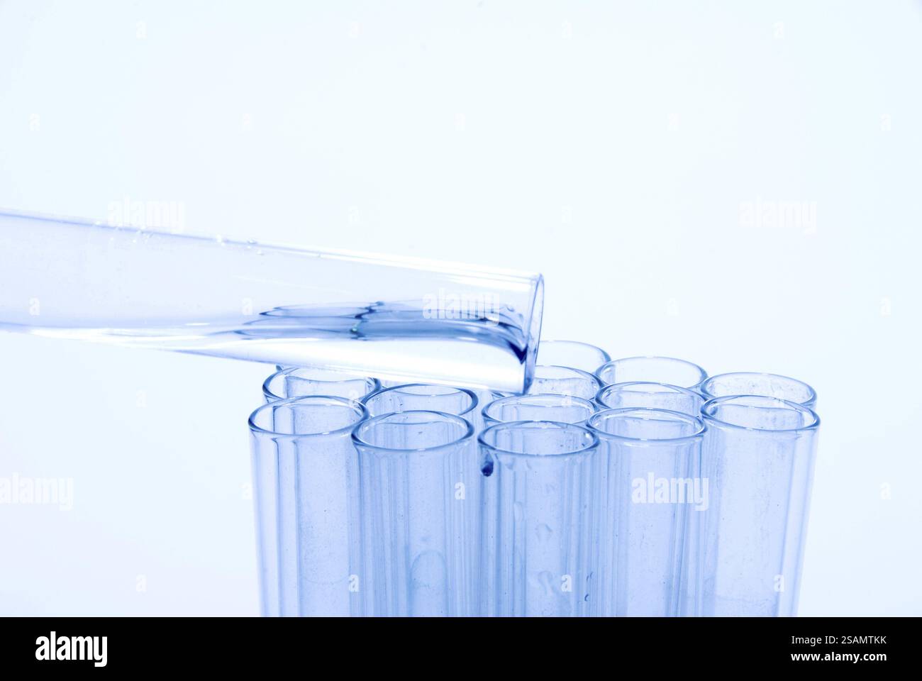 A series of test tubes being used in scientific experiments Stock Photo ...