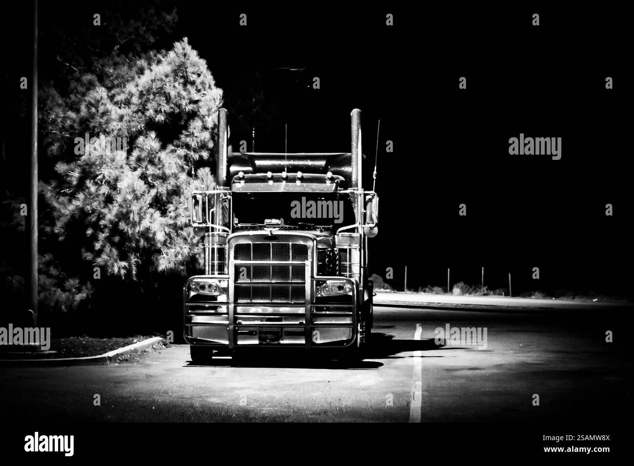 A big rig truck parked overnight in a rest area. Photographed in a film ...
