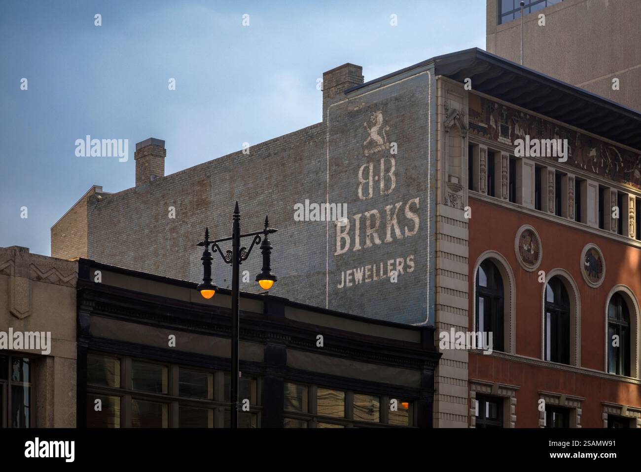 An old Birks Group Inc. logo painted on the side of a building in ...