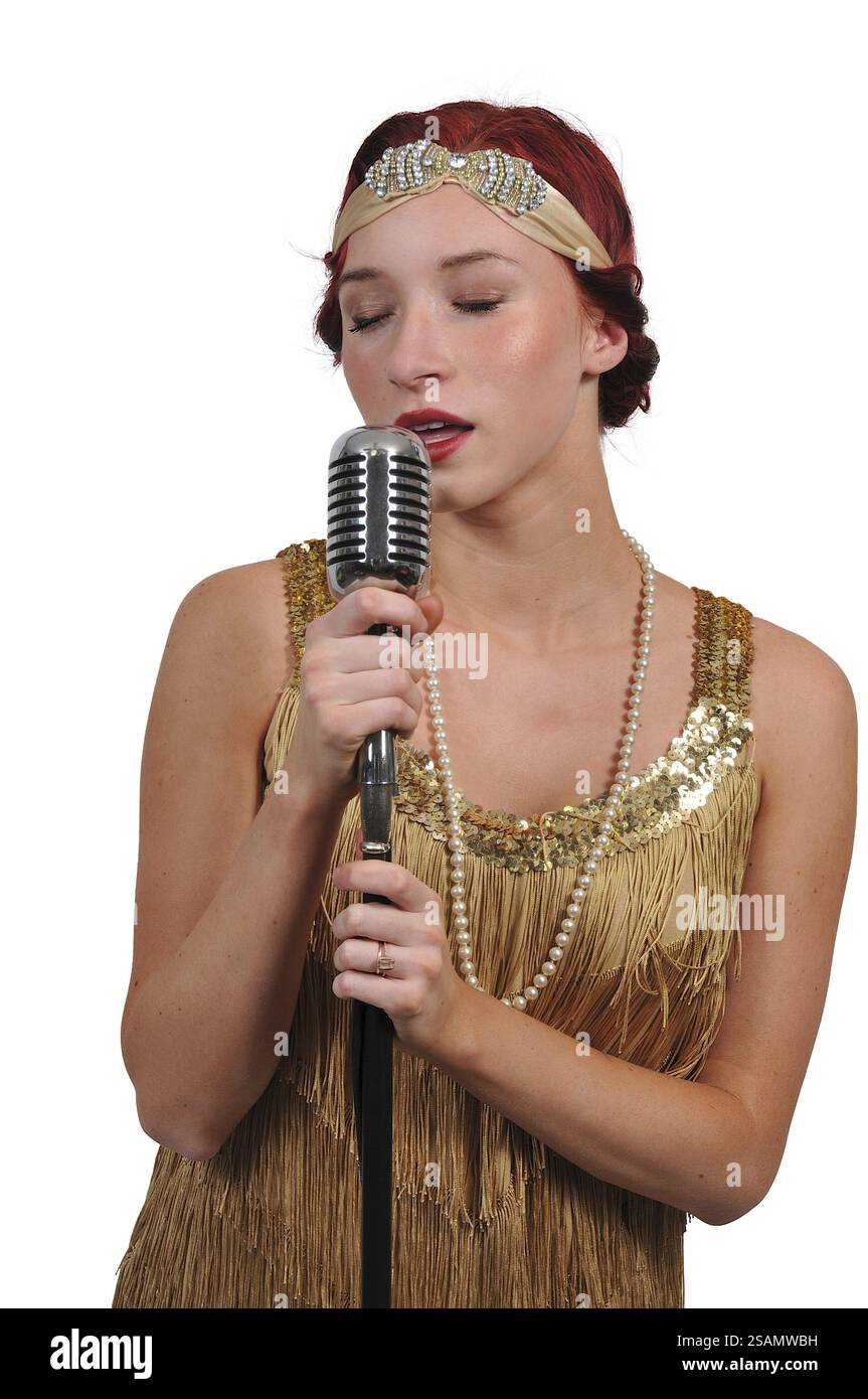 Beautiful woman singer performing with a vintage microphone Stock Photo ...