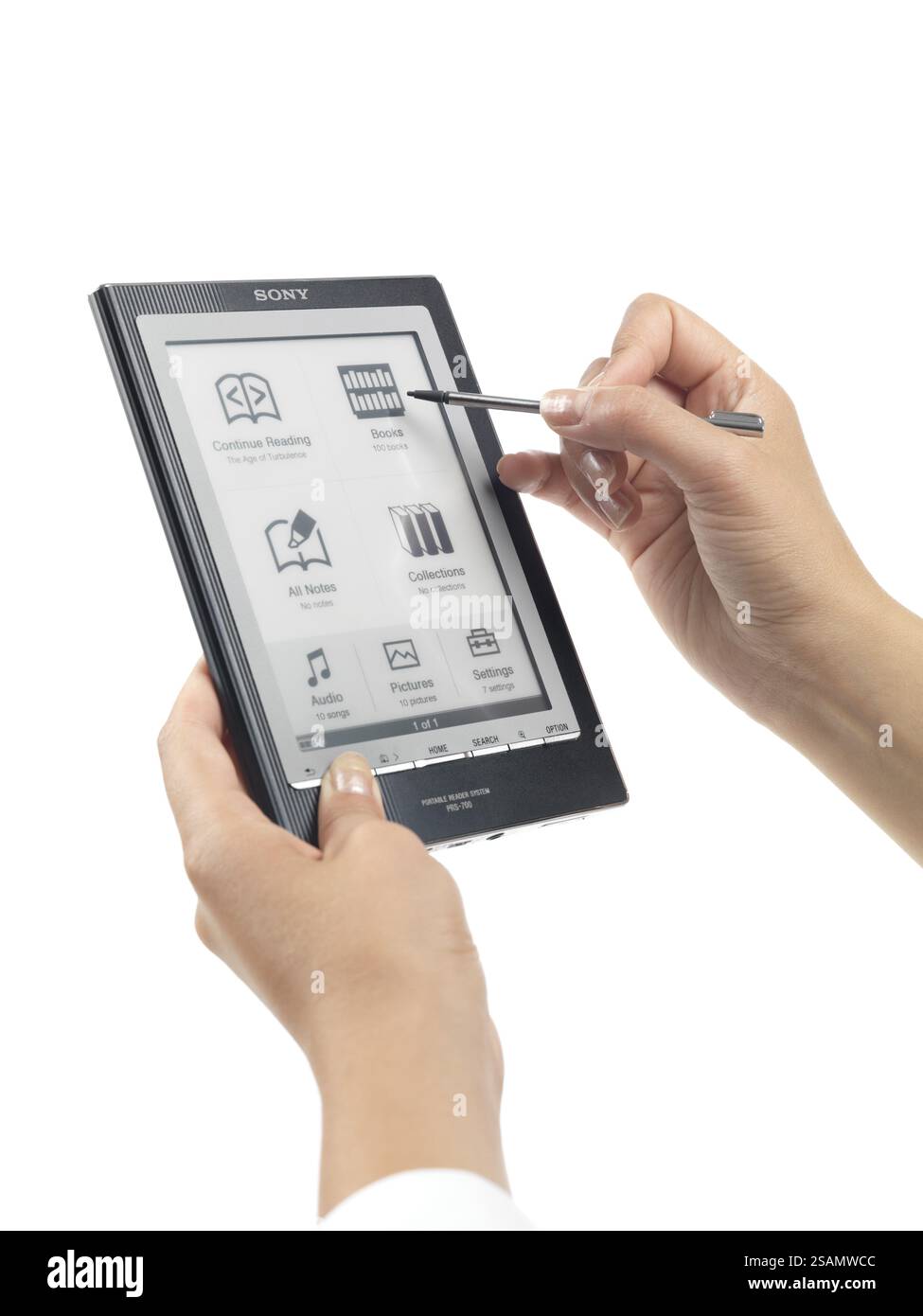 Woman using Sony Reader. PRS-700 Portable Reader System. Touch screen e ...