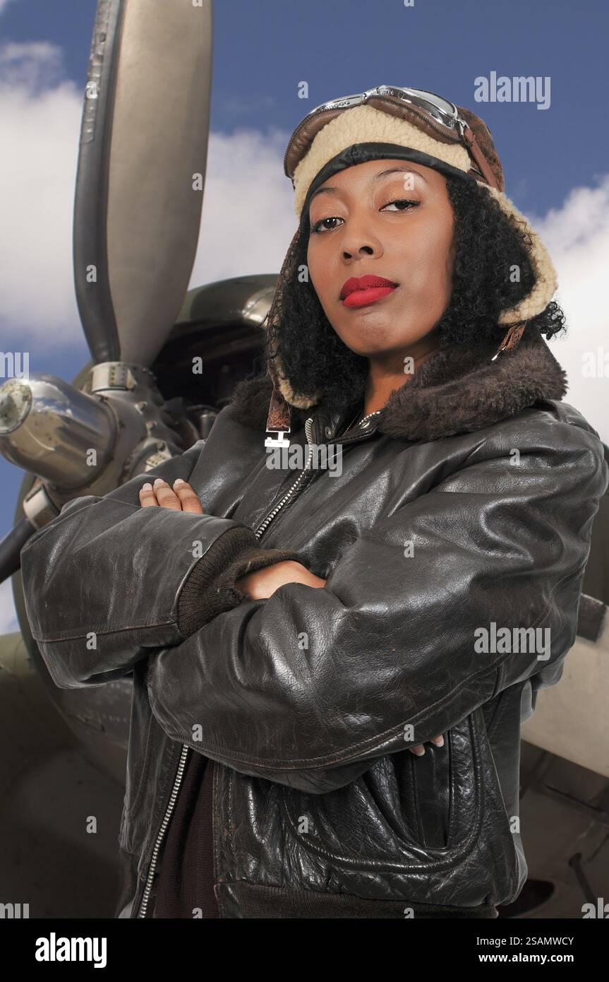 Woman pilot wearing vintage pilot helmet flight jacket and goggles ...
