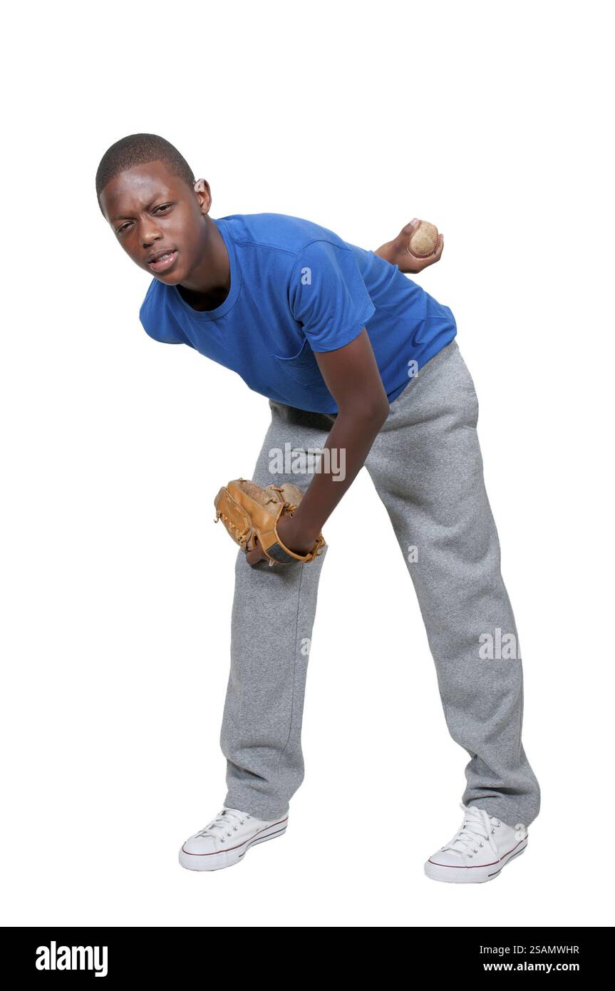 A black African American teenage man baseball pitcher getting ready to ...