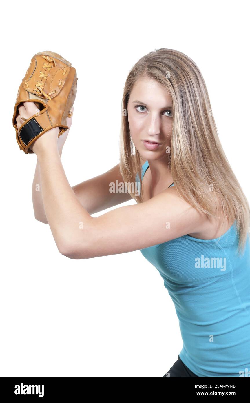 A beautiful woman baseball pitcher getting ready to throw a ball in a ...