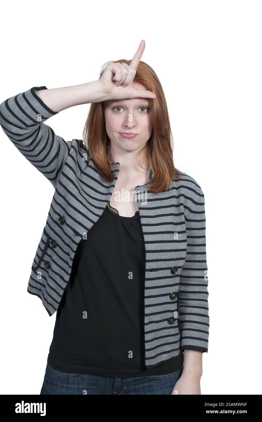 A woman making the loser sign with her hand Stock Photo - Alamy