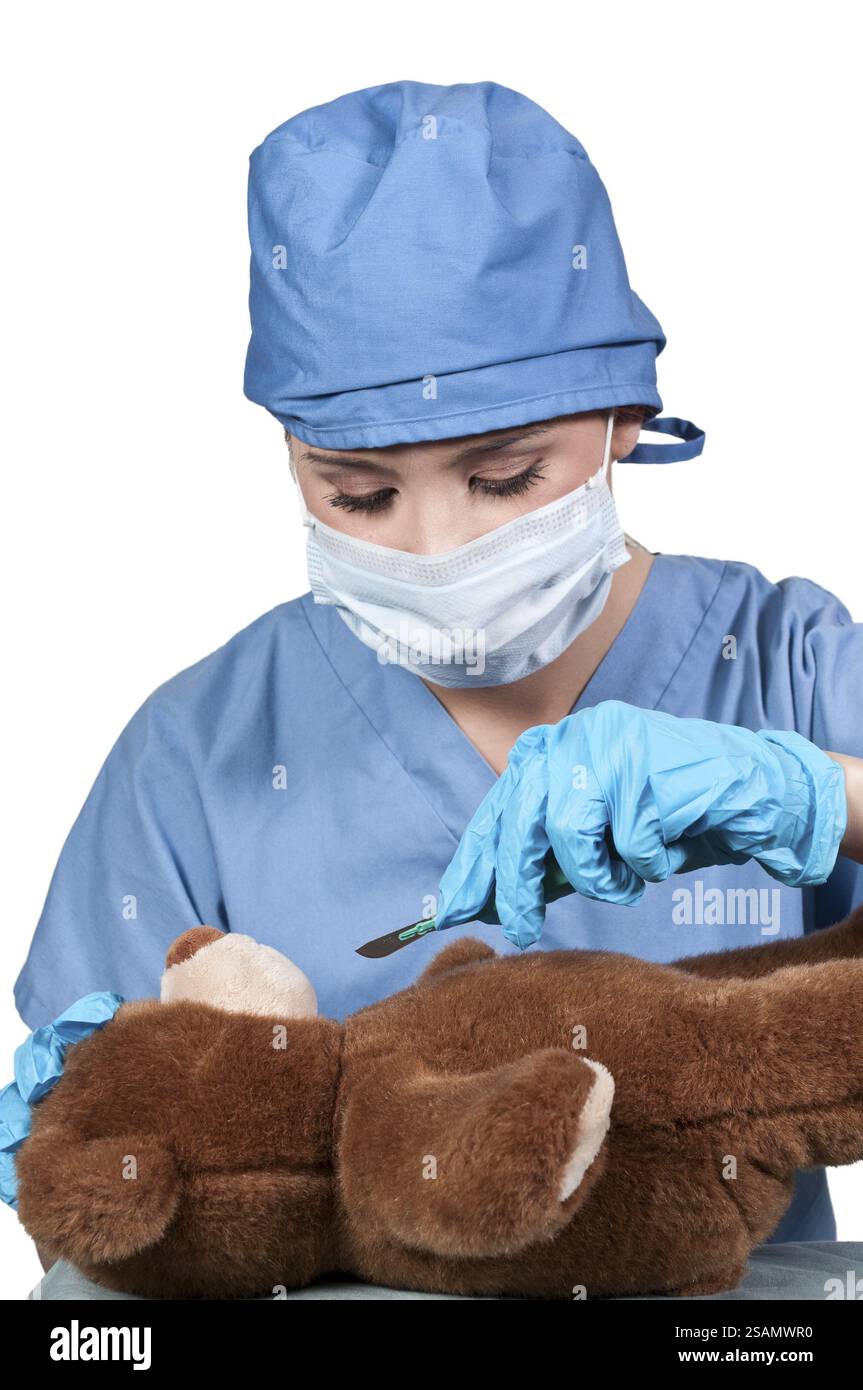 A beautiful young woman surgeon performing surgery Stock Photo - Alamy