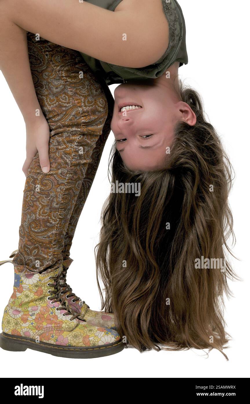 Beautiful young woman bent over in half Stock Photo - Alamy