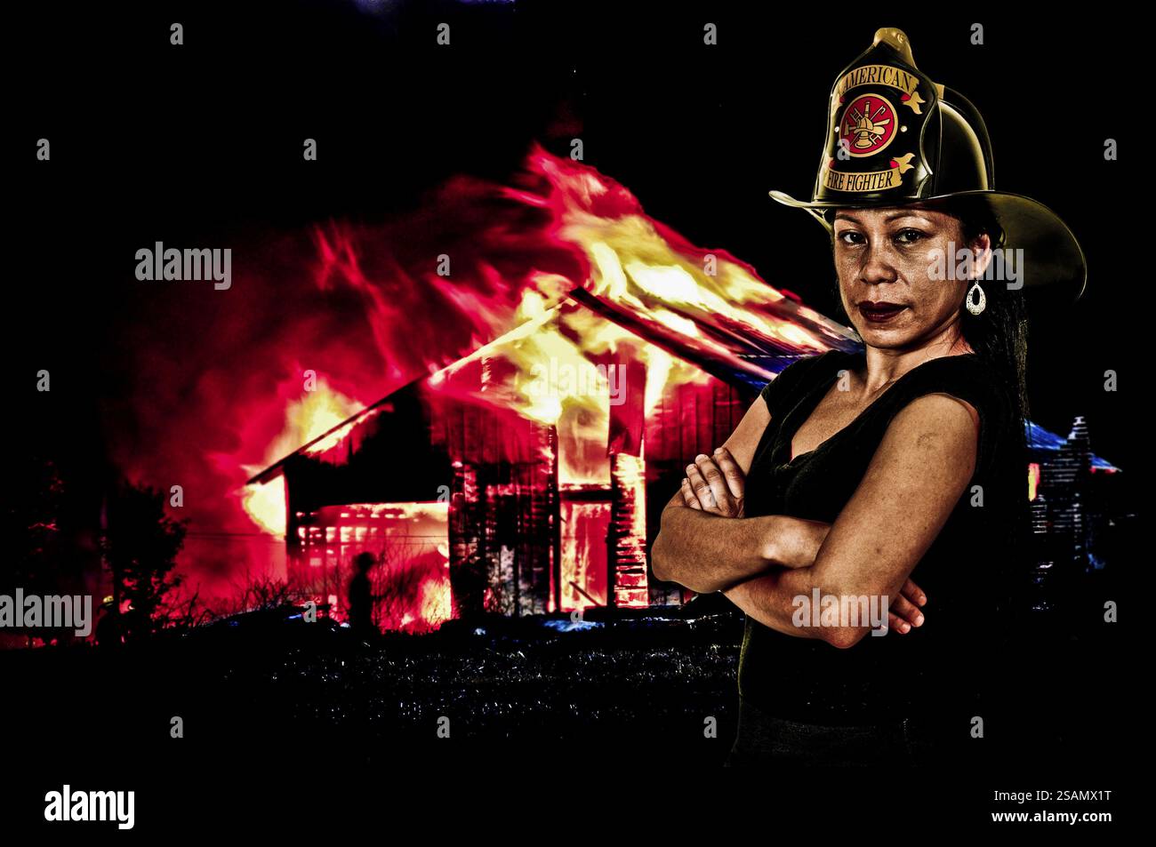 Beautiful young woman firefighter at a fire Stock Photo - Alamy