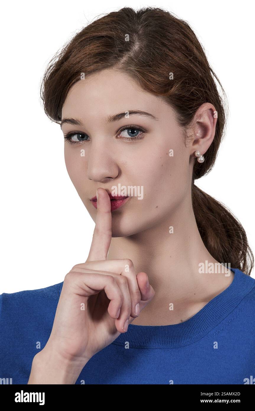 A woman saying be quiet by saying shhh Stock Photo - Alamy