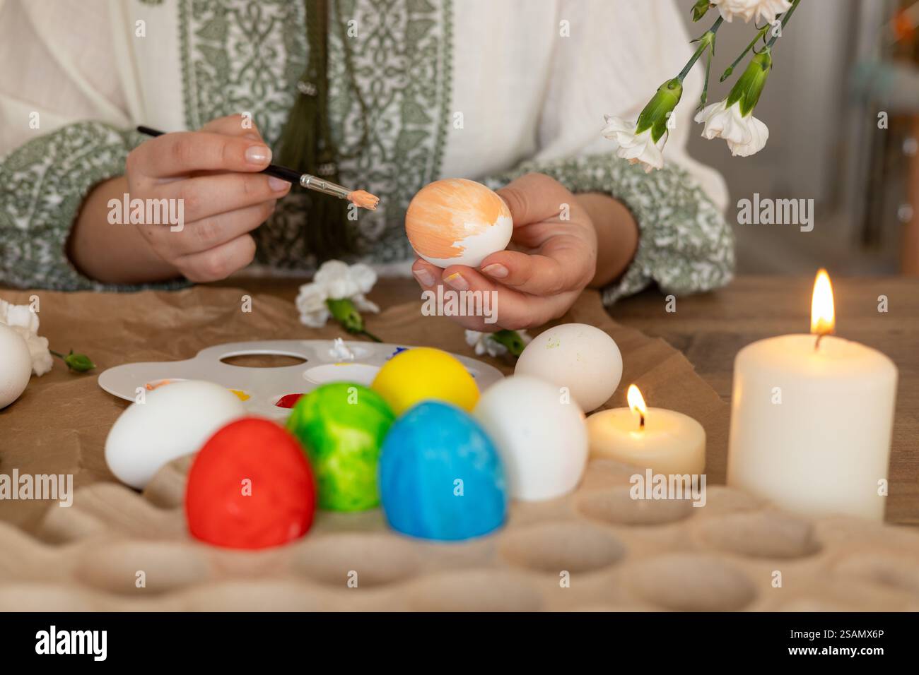 Decorating traditional Easter eggs with care in a springtime setting ...