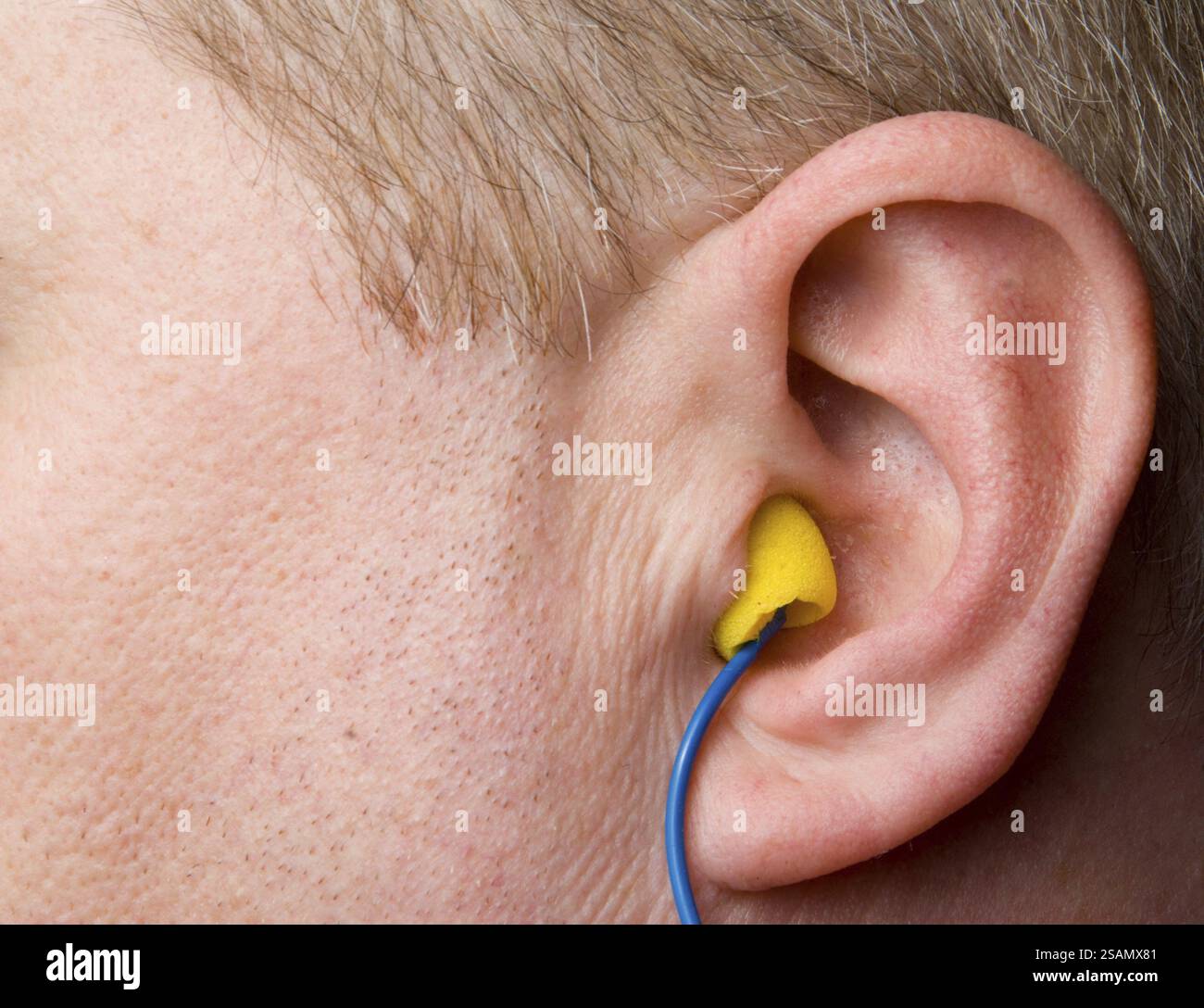 A set of personal protective equipment known as ear plugs Stock Photo ...