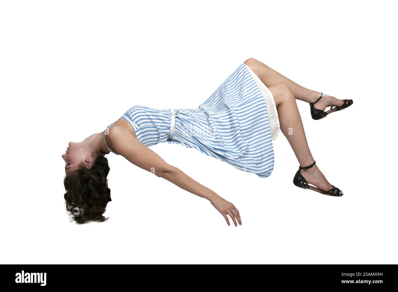 Beautiful young woman floating in the air Stock Photo - Alamy