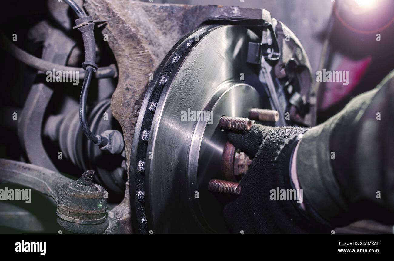 Mechanical part installation with light reflecting off the brake ...