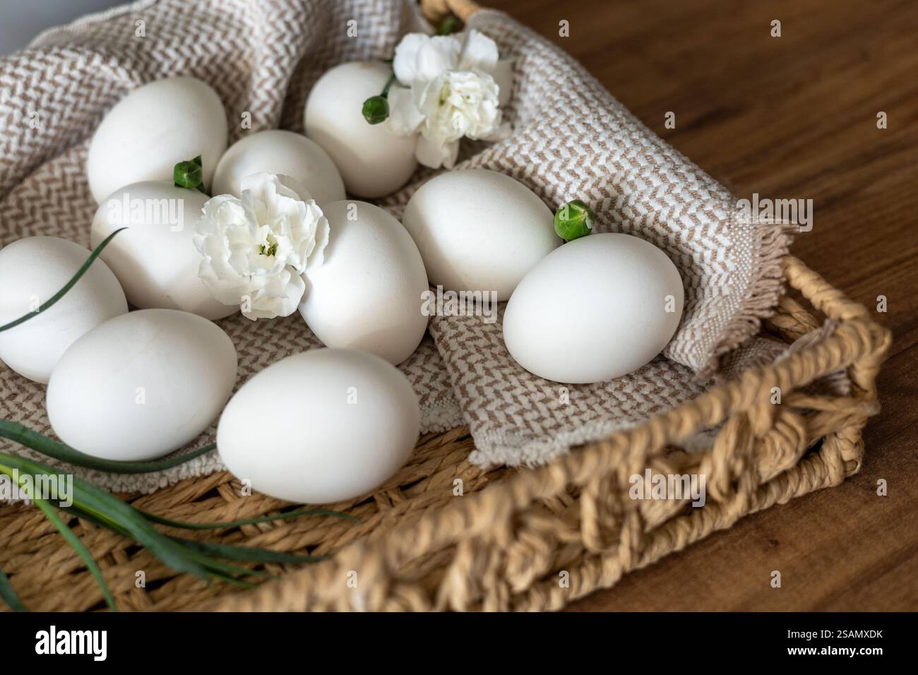 Handcrafted basket with white eggs ready for Easter celebrations in ...