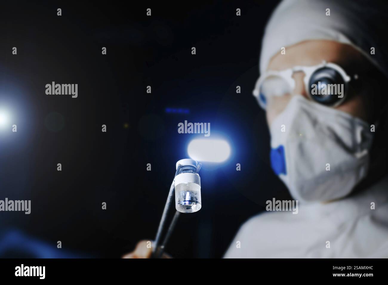 Scientist in blue uniform holding hi-res stock photography and images ...