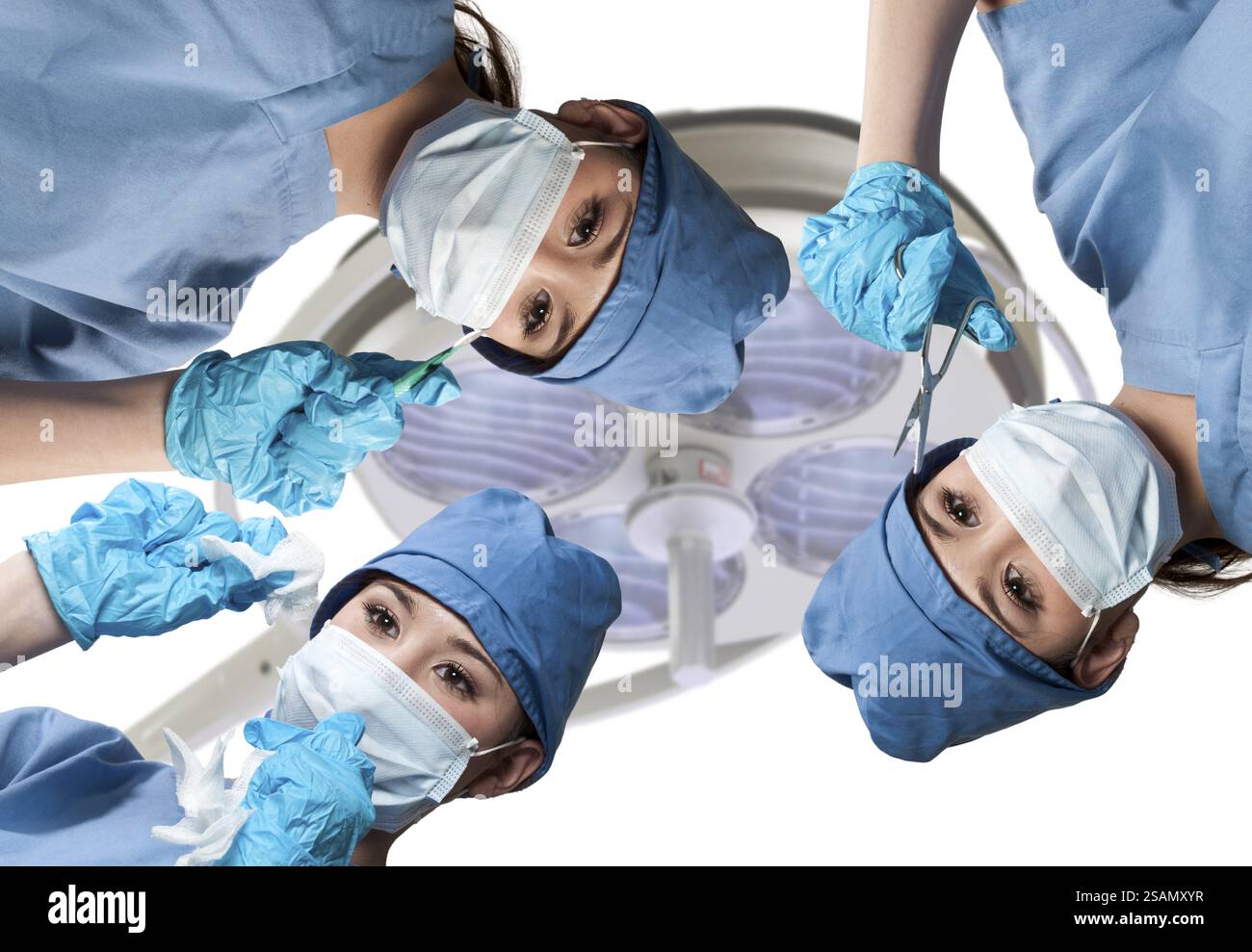 A beautiful young woman surgeon performing surgery Stock Photo - Alamy