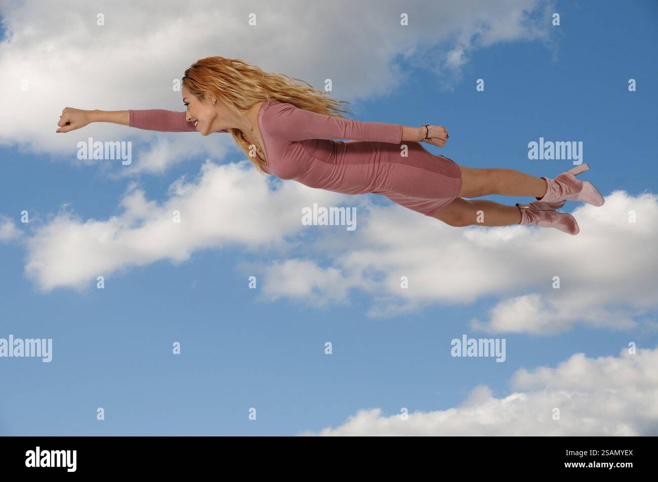 Beautiful young woman flying through hi-res stock photography and ...