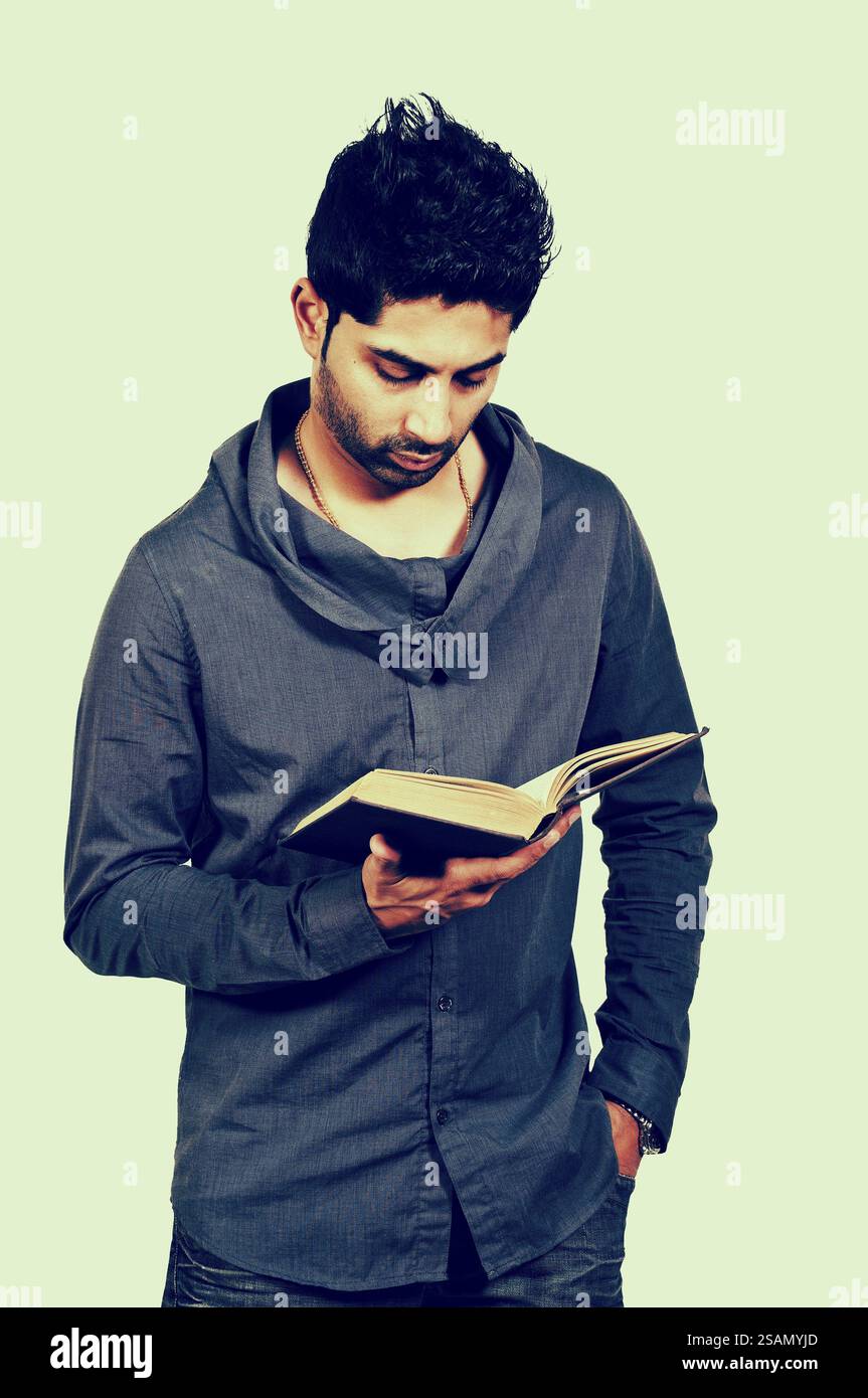 A handsome Arab man reading a book Stock Photo - Alamy