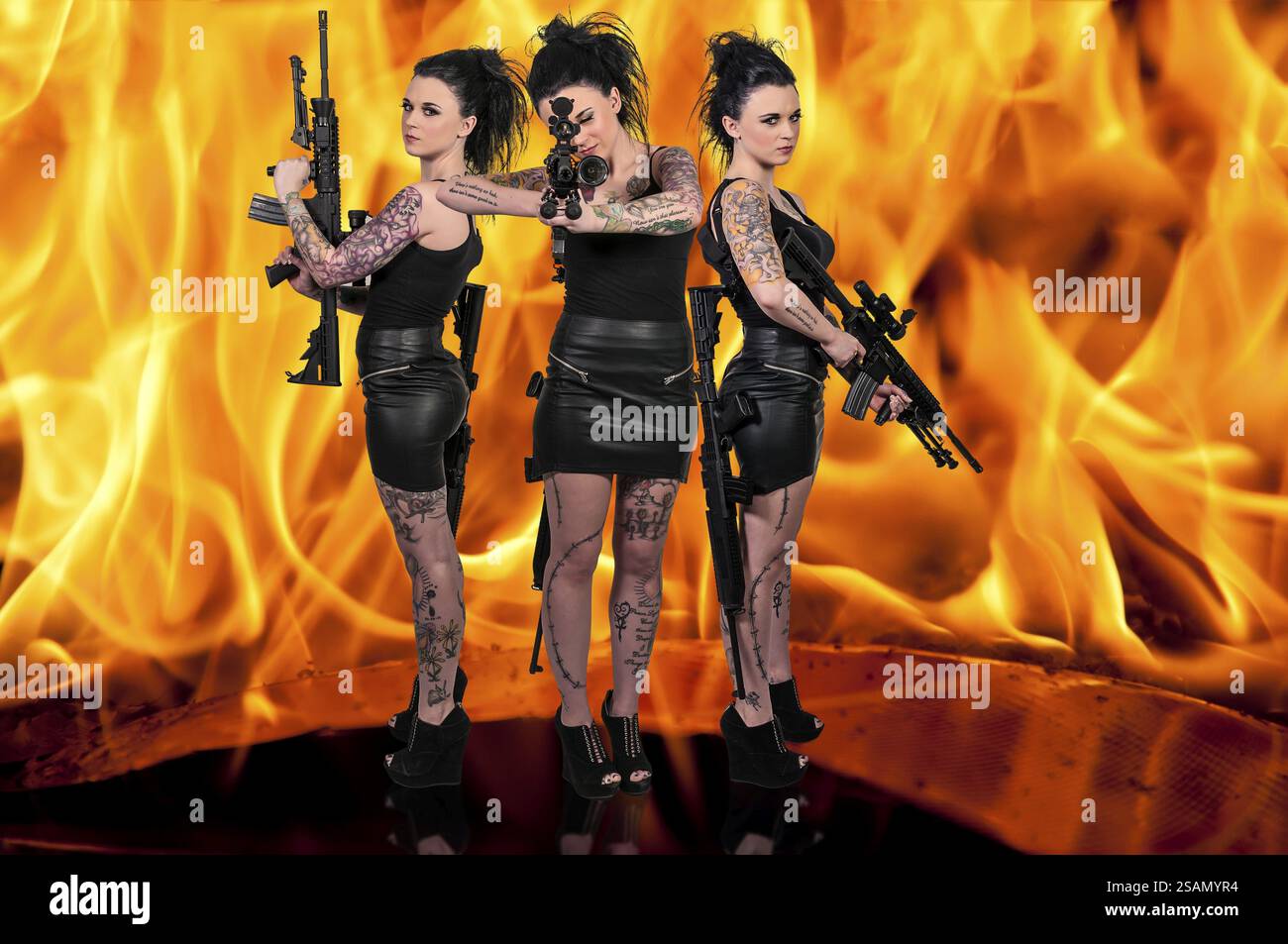 Beautiful young women holding an automatic assault rifles Stock Photo ...