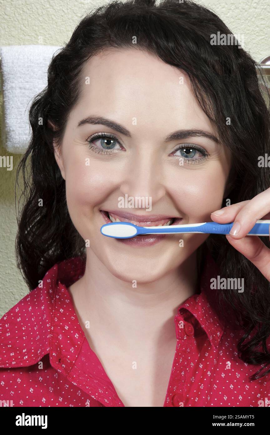 Beautiful woman practicing good oral dental care by brushing her teeth Stock Photo - Alamy