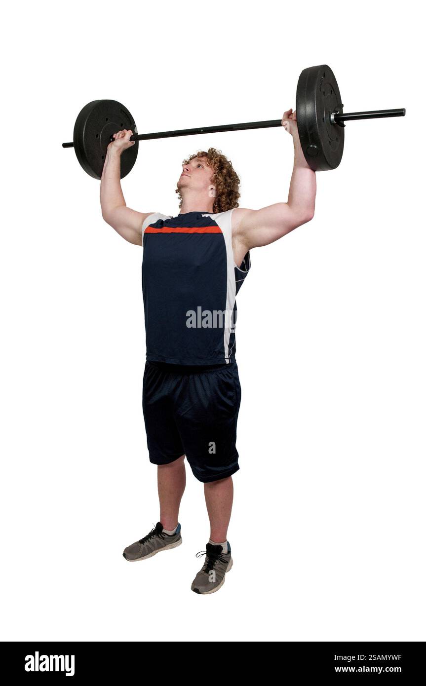 Handsome young muscular man lifting a weight Stock Photo - Alamy