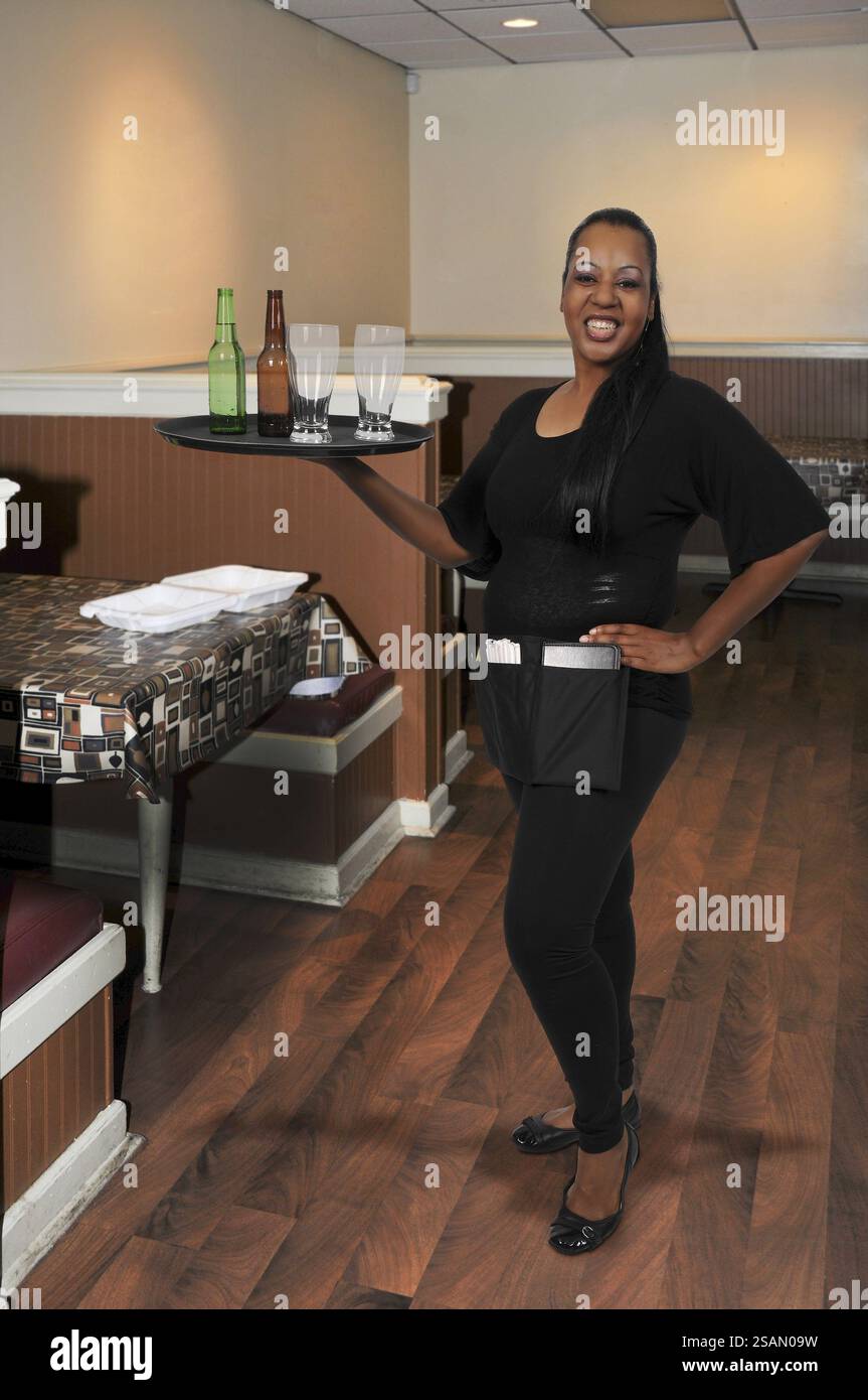 Woman food service worker server or waitress Stock Photo - Alamy