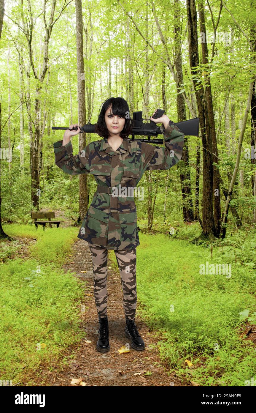 Beautiful young woman soldier with a M16 rifle Stock Photo - Alamy