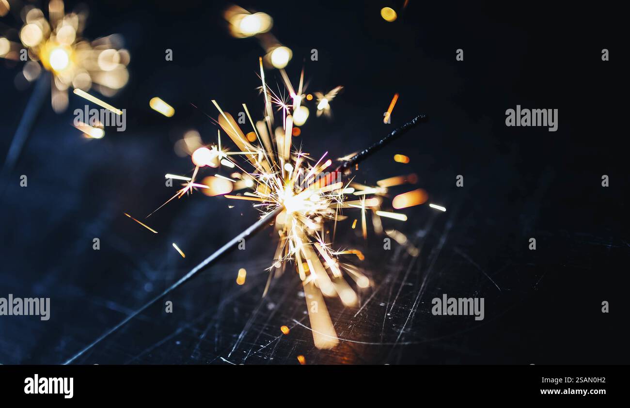 Brightly lit sparklers creating a festive burst of light and energy ...