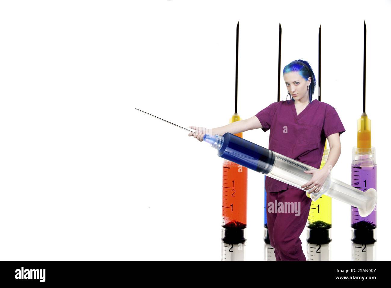 A medical doctor or nurse in scrubs preparing an injection in a giant ...