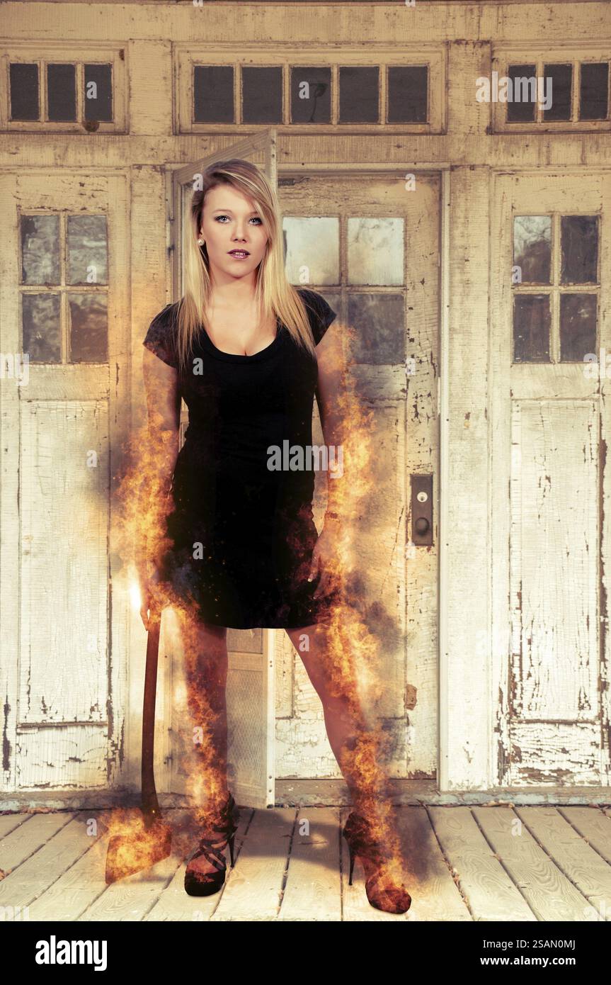 Beautiful possessed woman in a trance holding an axe Stock Photo - Alamy