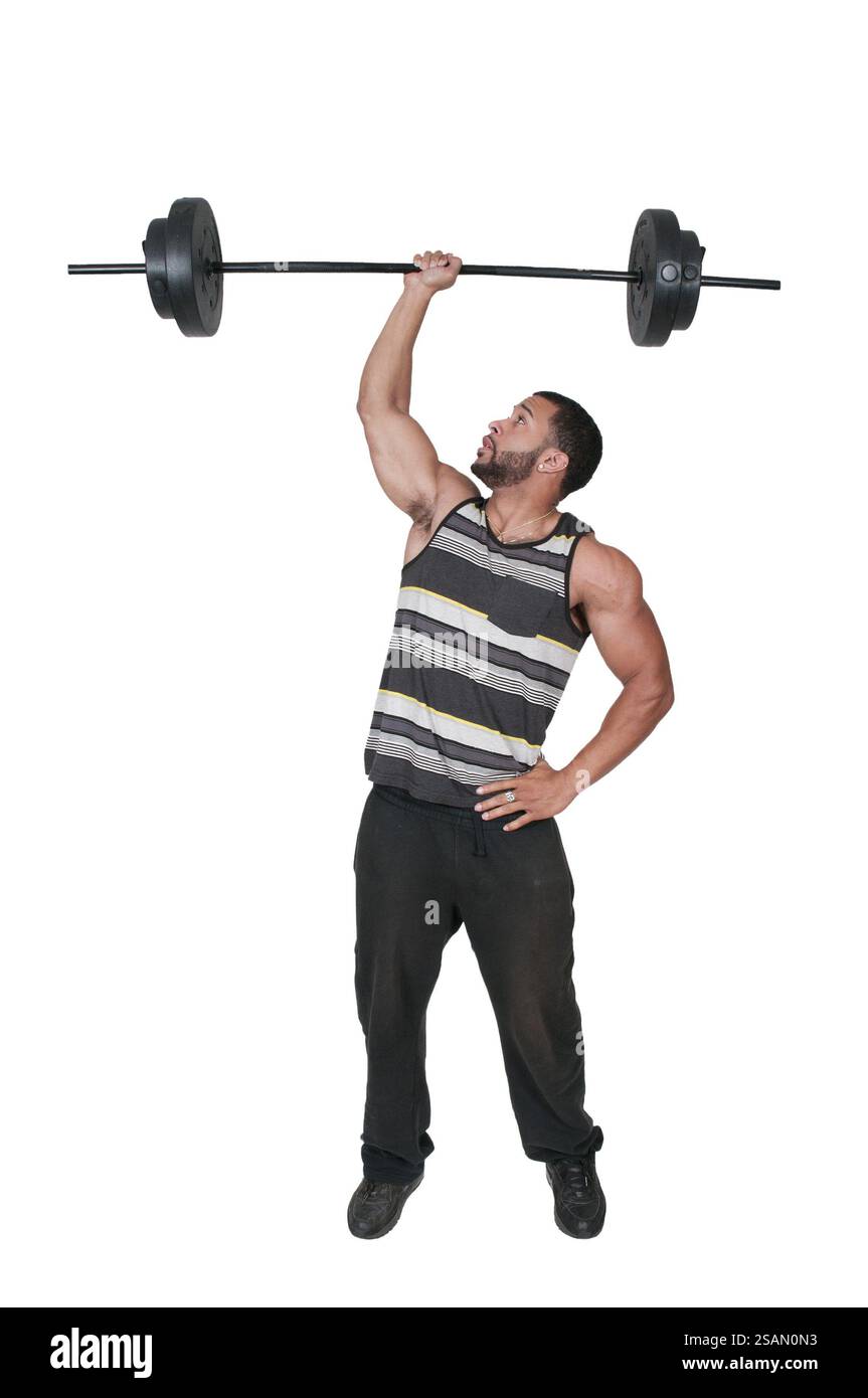 Handsome young muscular man lifting a weight Stock Photo - Alamy