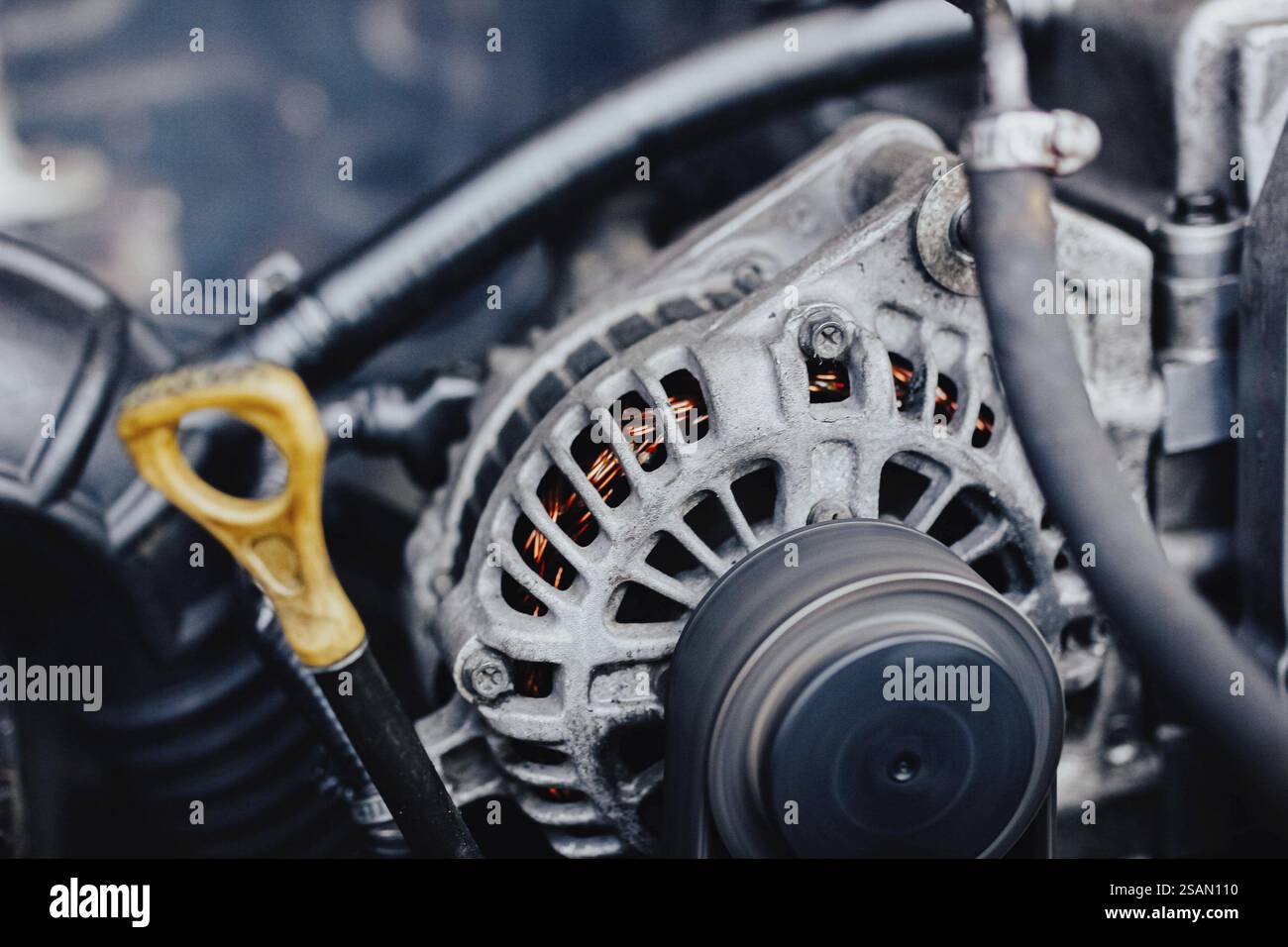 Close-up of an engine alternator with visible metal structure and pipes ...