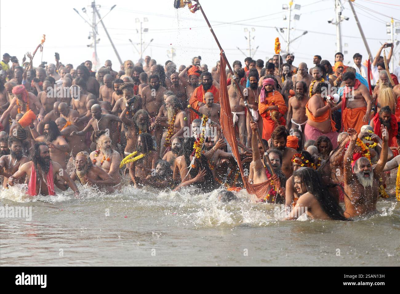 Holymen(Sadhus) take holy bath at the bank of Sangam on the occasion of ...