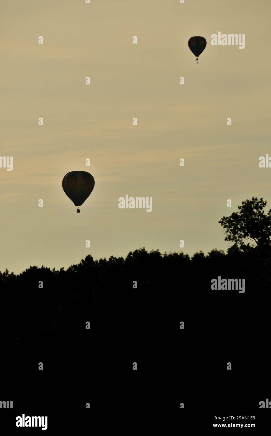 Hot air balloon rising above the horizon Stock Photo - Alamy