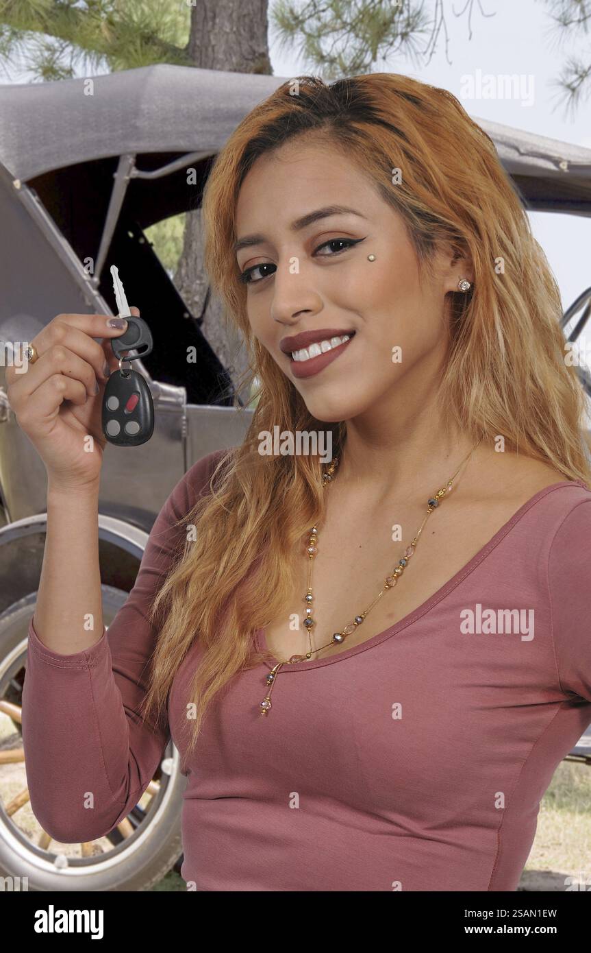 Woman holding keys to a new car Stock Photo - Alamy