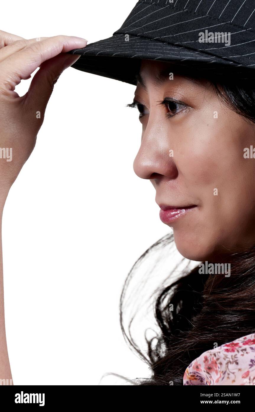 Beautiful asian woman in a fedora hat Stock Photo - Alamy