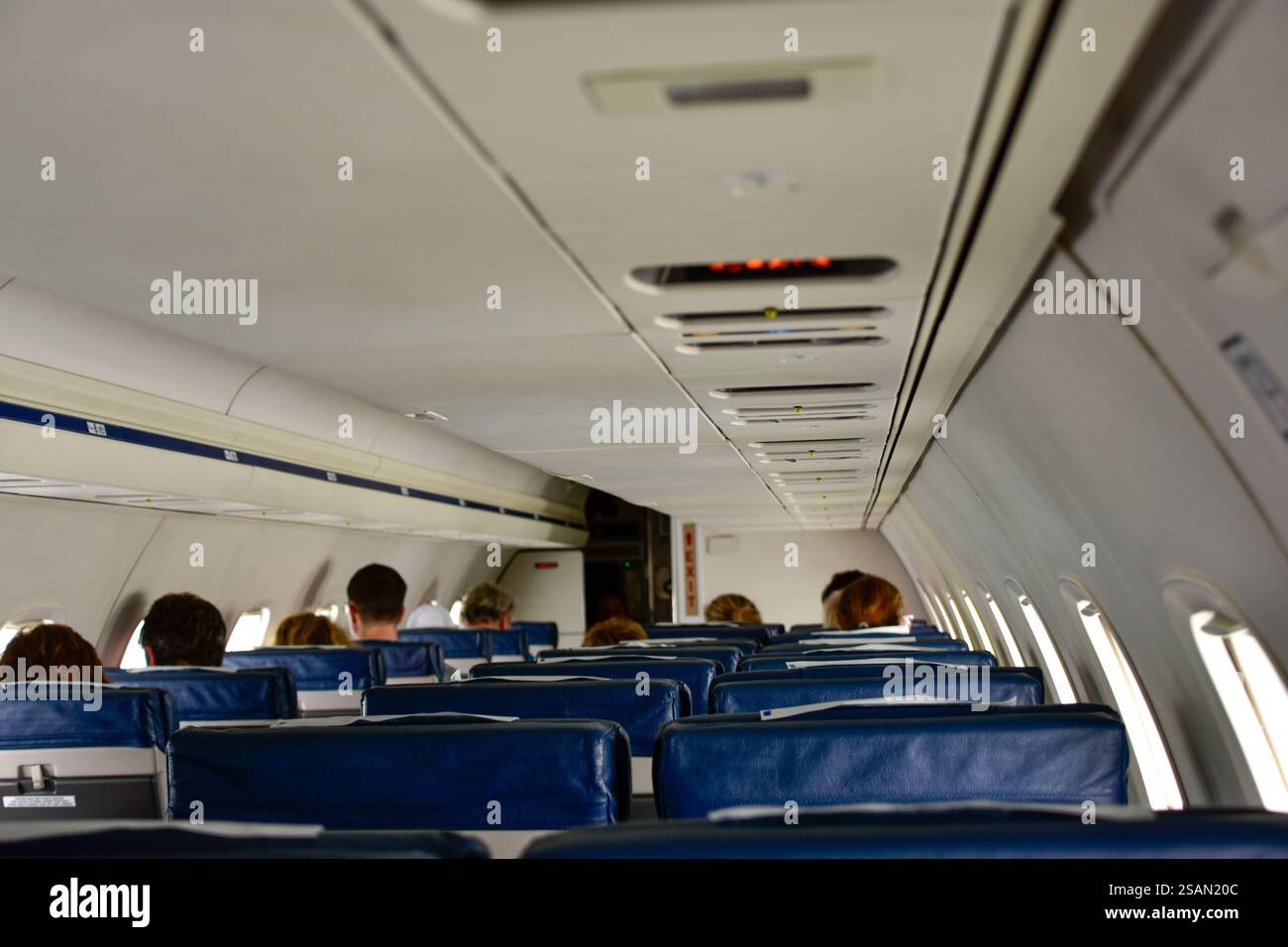 The aisle on a small plane during flight Stock Photo - Alamy