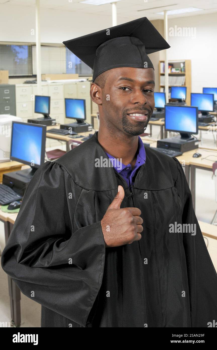 Young black African American man in his graduation robes Stock Photo ...