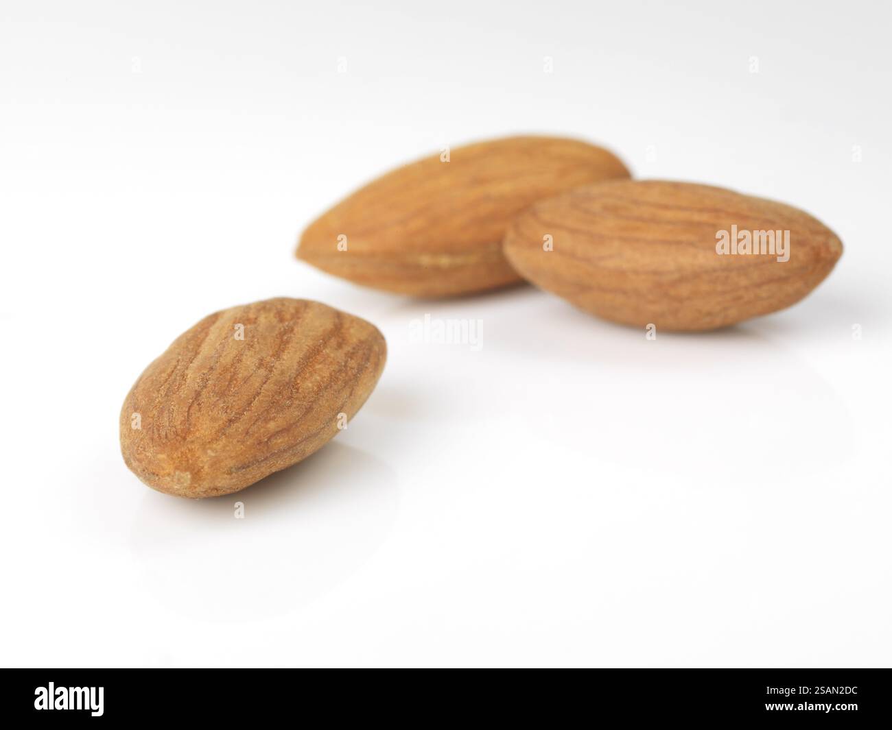 Closeup of almonds, almond seeds, nuts, isolated on white studio ...