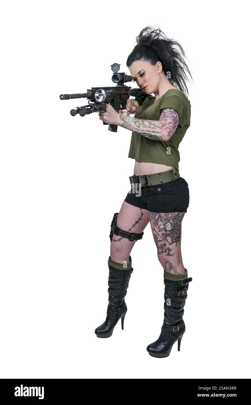 Beautiful young woman holding an automatic assault rifle Stock Photo ...