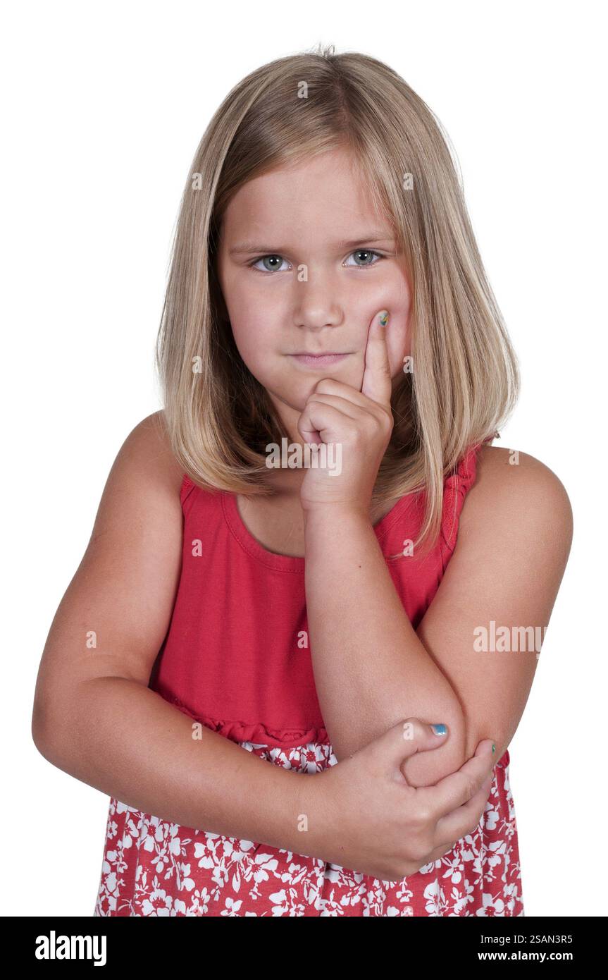 Beautiful little girl thinking and deep in thought Stock Photo - Alamy