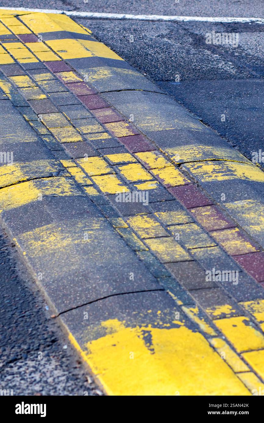 There is a car on the road that has a license plate beginning with the ...