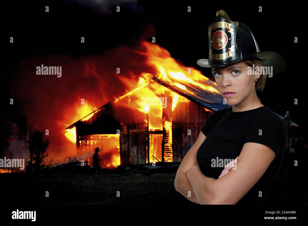 Beautiful young woman firefighter at a fire Stock Photo - Alamy