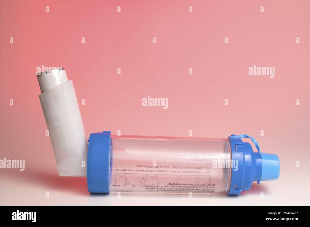 An asthma inhaler with an extension tube Stock Photo - Alamy