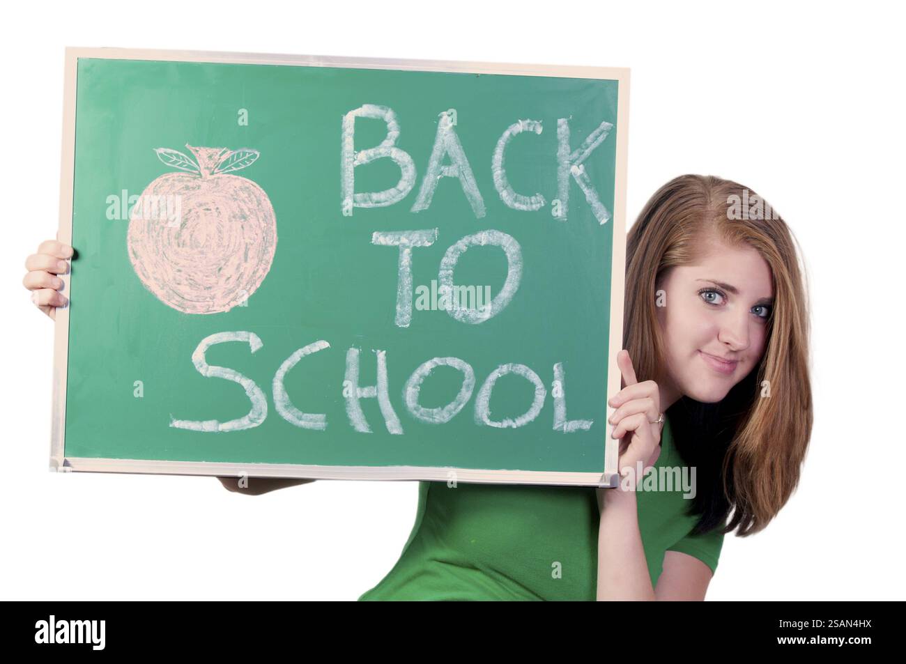 A beautiful teenaged girl holding a back to school sign Stock Photo - Alamy