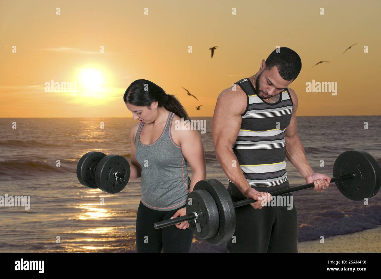 Personal trainer coaching a client as they exercise Stock Photo - Alamy