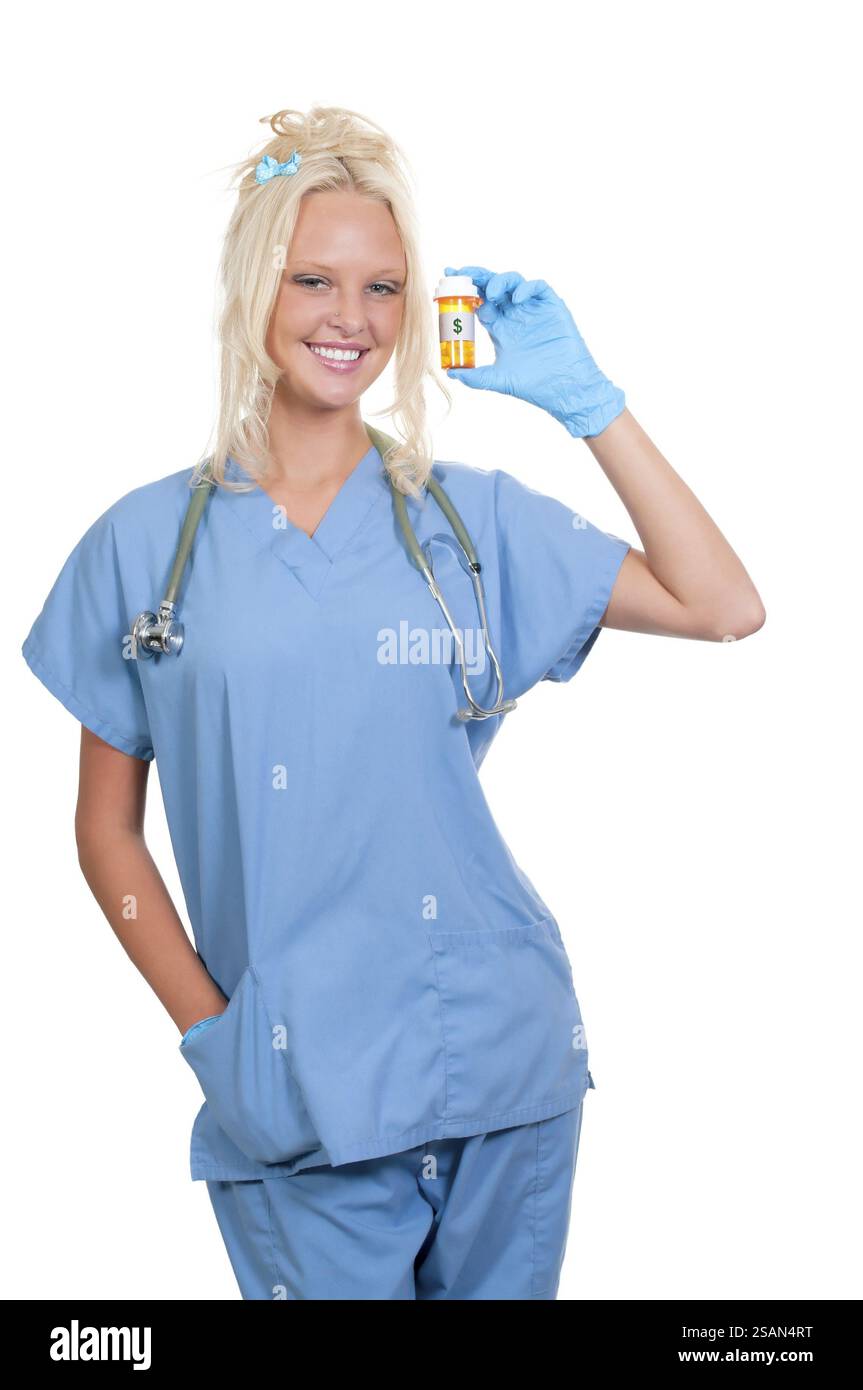 A beautiful young female doctor on her rounds holding a pill bottle of ...